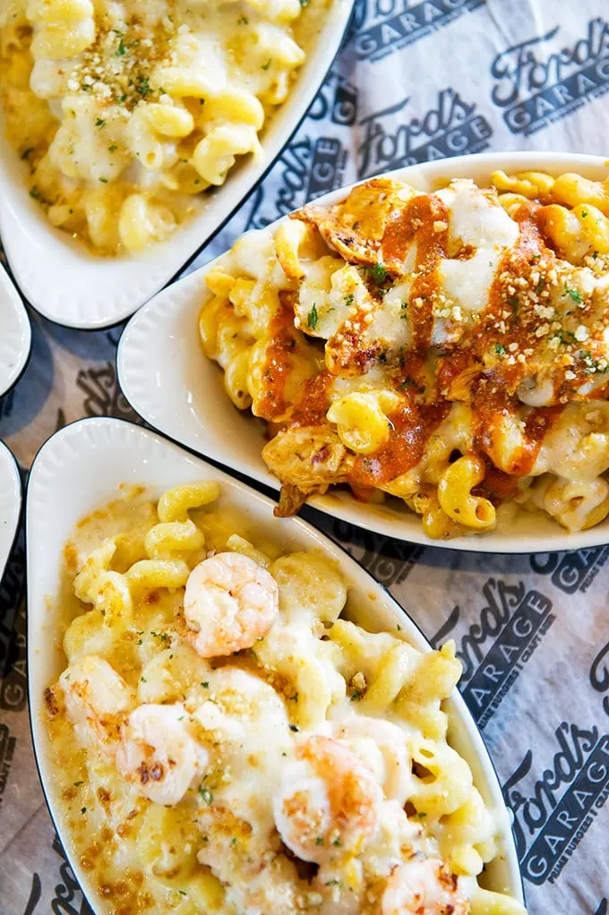 The holy trinity of mac and cheese variations: classic comfort, buffalo-spiked adventure, and seafood luxury. Your diet plan just called—it's taking the night off.