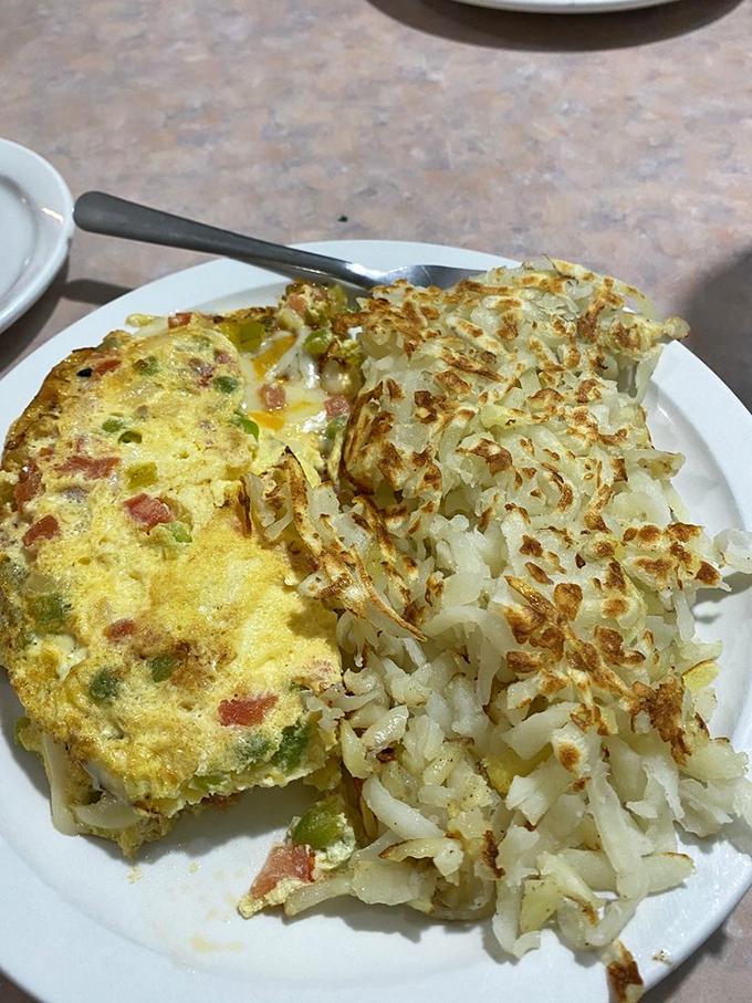 This omelet and hash browns combo is the Batman and Robin of breakfast—a dynamic duo that always saves the day.