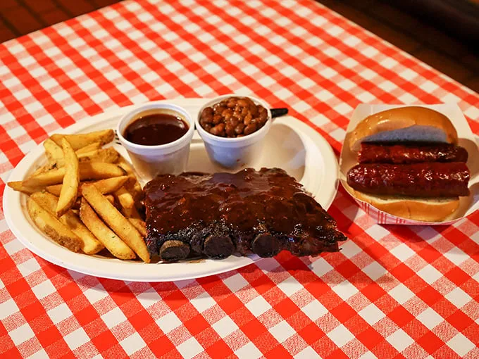 The BBQ trifecta: ribs, fries, and slaw. It's like the Three Musketeers of comfort food, ready to defend your right to deliciousness.