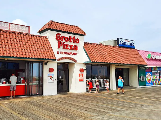 Grotto Pizza on the boardwalk—where the spiral of sauce meets the spiral of life, and vacation memories are served by the slice.