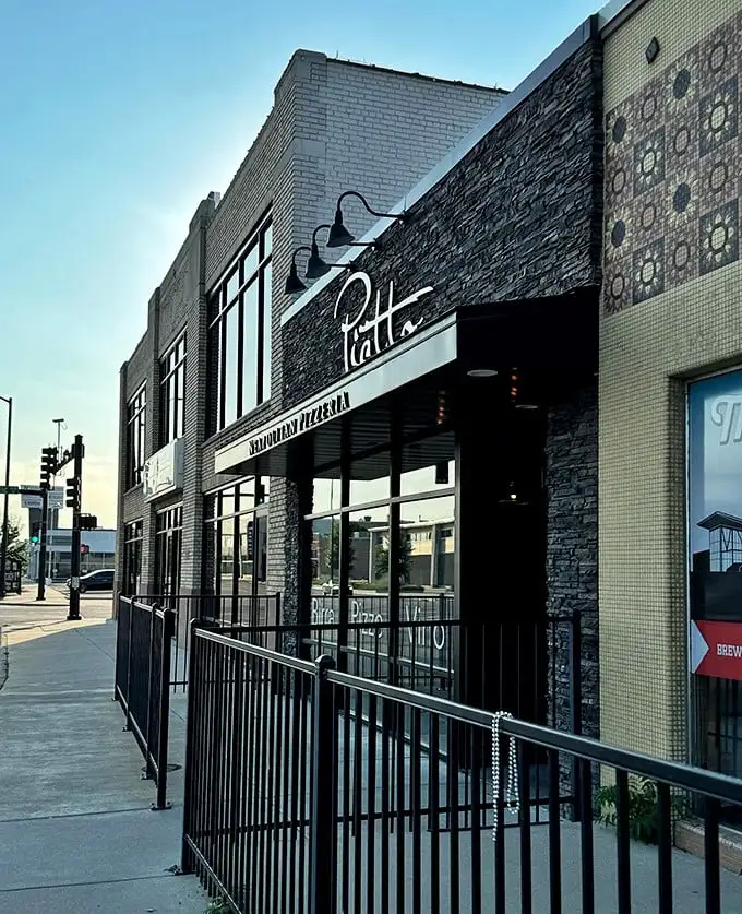 The elegant stone and glass exterior of Piatto—where Wichita meets Naples in a 900-degree love affair.