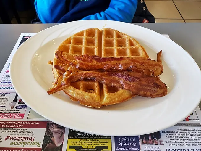 The ultimate power couple: waffles and bacon. It's like breakfast's Batman and Robin, ready to save you from hunger's villainous grip.