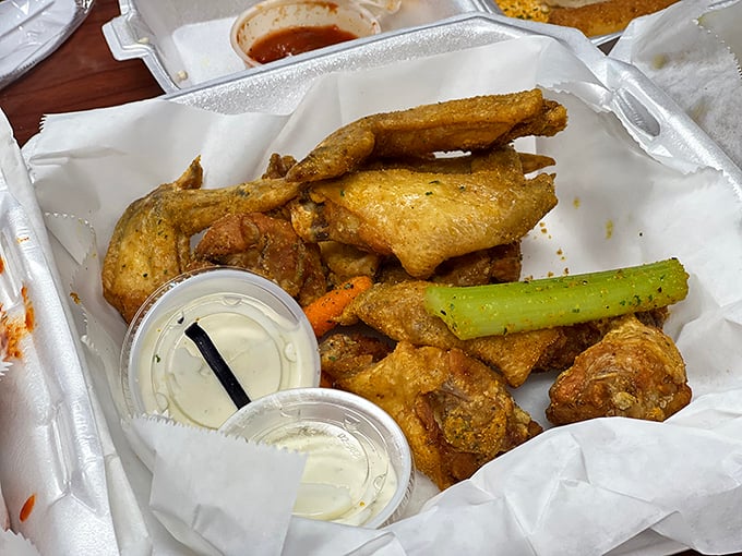 Wings served "naked" with dipping sauce on the side—a blank canvas for flavor artists who like to control their own heat destiny.