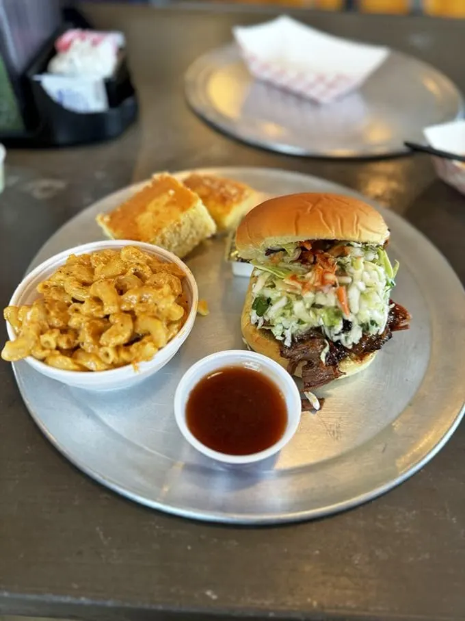 The dynamic duo of comfort food: a brisket sandwich that could make a Texan weep, paired with mac and cheese that's pure cheesy bliss.