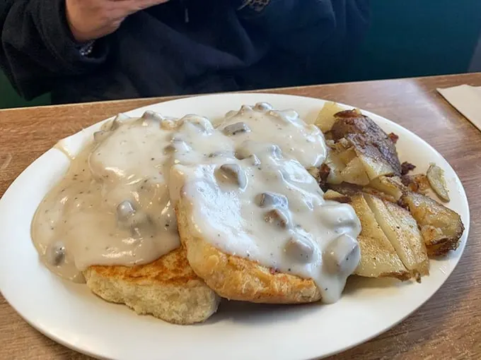 Biscuits and gravy, meet your new best friend: home fries. This plate is the breakfast version of a superhero team-up, ready to save your morning.