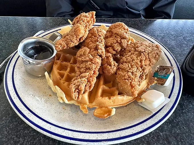 Behold, the holy trinity of comfort food! Crispy chicken perched atop a golden waffle – it's like your taste buds won the lottery.