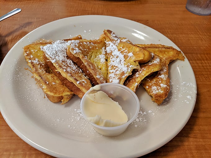 French toast that's more "ooh la la" than "oh la la". Crispy, golden, and dusted with powdered sugar – it's breakfast's answer to dessert.