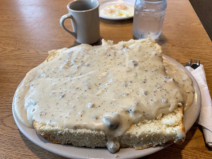 Holy mother of carbs! This biscuits and gravy platter is big enough to have its own zip code. Fork not included – you might need a shovel.