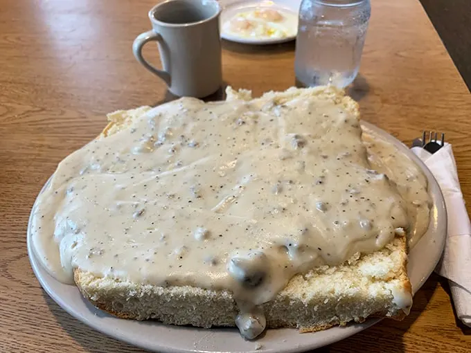 Holy mother of carbs! This biscuits and gravy platter is big enough to have its own zip code. Fork not included – you might need a shovel.