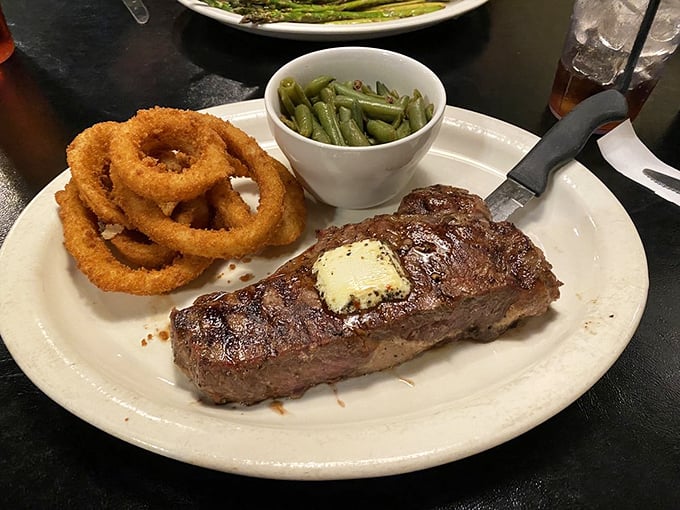 KC Strip, meet your crispy comrades! This plate is bringing more rings than a jewelry store and enough green to make your doctor smile.