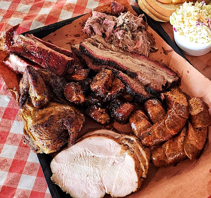 This tray isn't just dinner; it's a celebration on butcher paper. Every meat group represented, like a United Nations of barbecue diplomacy.