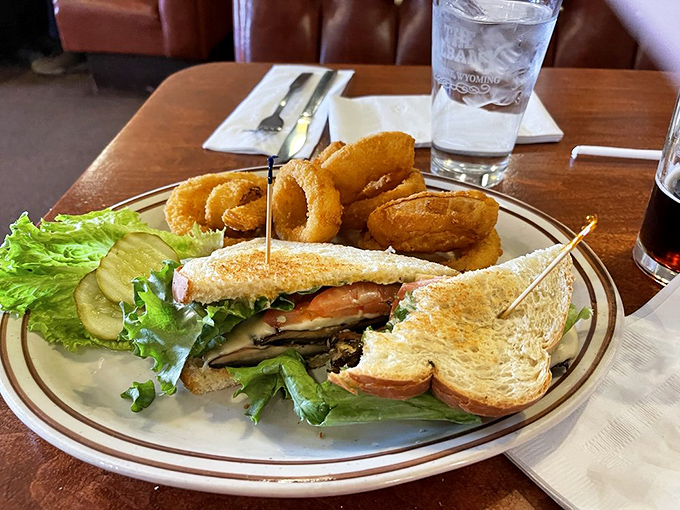 Mushroom Swiss burger meets onion rings – a duo more iconic than Batman and Robin. It's comfort food with a crispy twist!