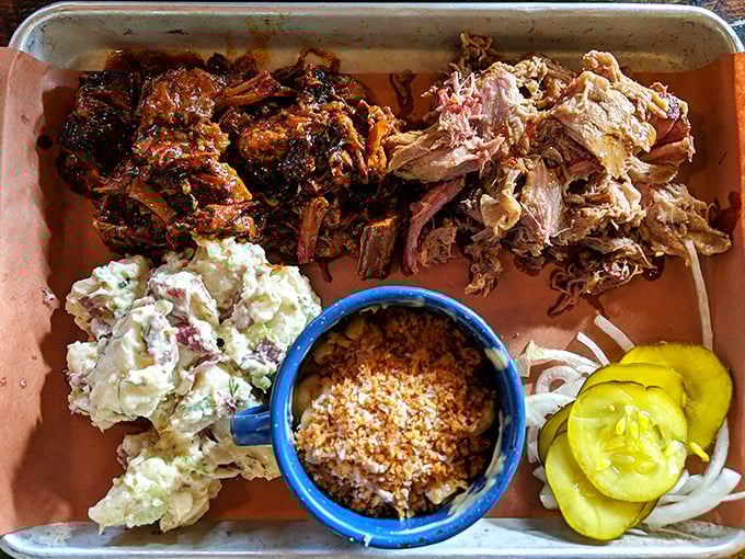Those bright pickles aren't just garnish—they're little acid bombs strategically deployed to cut through the richness of that gloriously shredded pork.
