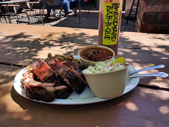 A plate that would make Fred Flintstone jealous! Ribs, sides, and pickles – oh my! It's a carnivore's dream come true.