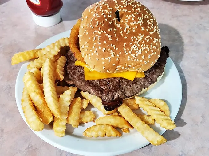Behold, the burger that launched a thousand napkins. It's not just a meal; it's a delicious challenge to your jaw's capacity.