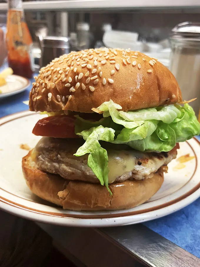 Hold onto your taste buds! This burger is stacked higher than a Jenga tower and twice as likely to make you say "Oh yeah!"