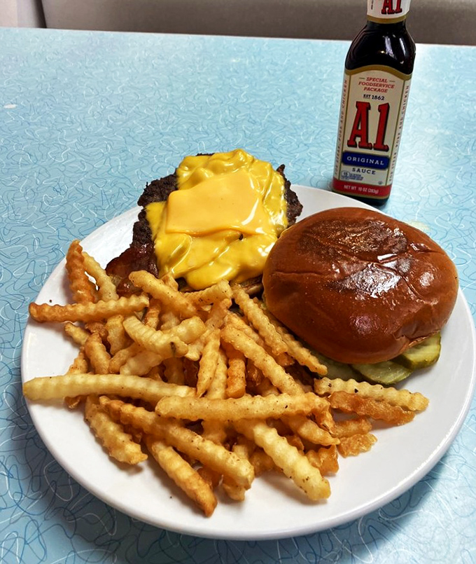 A cheeseburger that doesn't need fancy aioli or artisanal buns to prove its worth—just A1 sauce and the confidence that comes from decades of perfection.