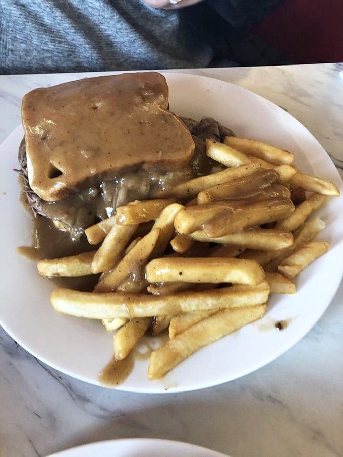 The hot roast beef sandwich: a gravy-soaked masterpiece that laughs in the face of napkins. Embrace the mess!