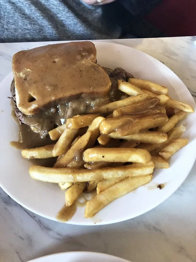 The hot roast beef sandwich: a gravy-soaked masterpiece that laughs in the face of napkins. Embrace the mess!
