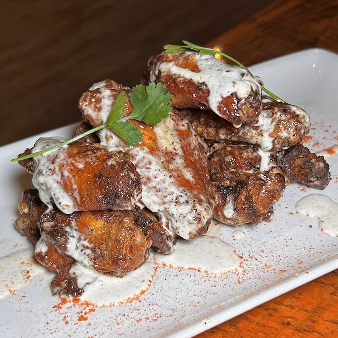These aren't just wings—they're flavor vehicles dressed in creamy sauce that make you reconsider everything you thought you knew about chicken appendages.