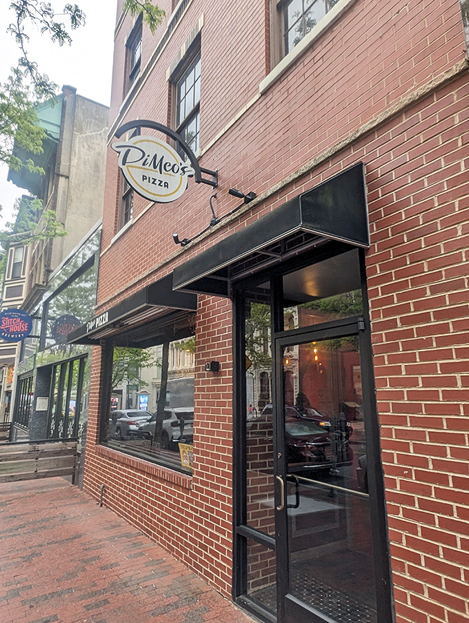 DiMeo's brick façade gives nothing away, like a poker player with a royal flush—the real action is happening inside that imported Italian oven.