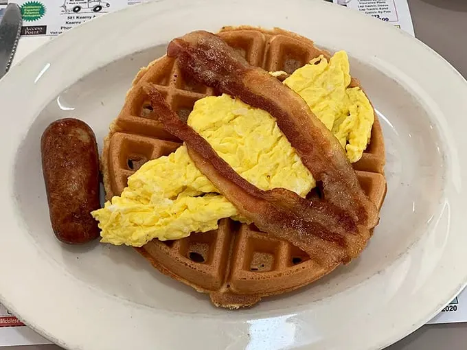 Waffle perfection achieved! This golden disc isn't just food; it's a carb-loaded work of art that belongs in the Louvre of breakfast.