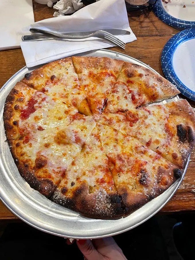 Sometimes, simplicity is the ultimate sophistication. This cheese pizza is the little black dress of the pizza world – timeless and always in style.
