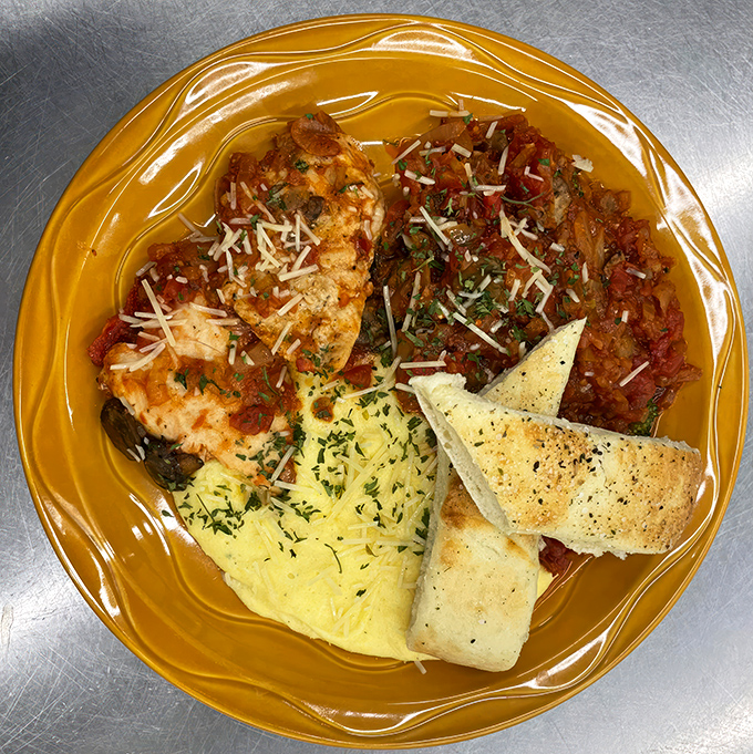 Chicken Cacciatore with a side of… is that polenta? It's like Italy took a detour through South Dakota, and we're all better for it.