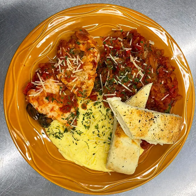 Chicken Cacciatore with a side of… is that polenta? It's like Italy took a detour through South Dakota, and we're all better for it.