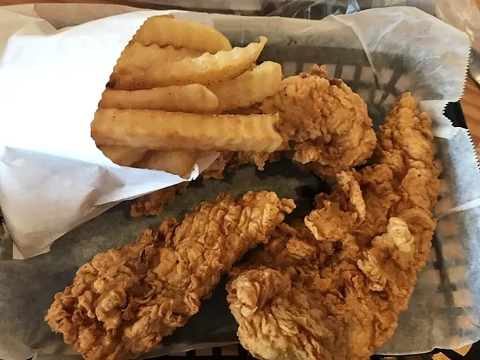 Chicken strips that actually deserve the name "strips" rather than "tiny fragments," served alongside fries that clearly never saw the inside of a freezer.