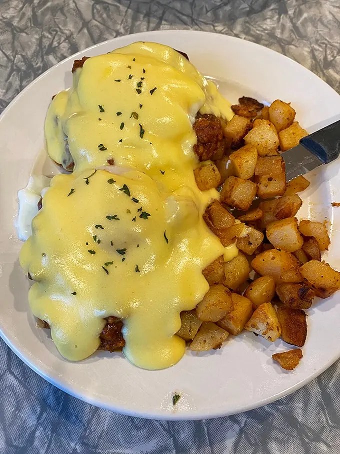 Eggs Benedict: Where hollandaise sauce flows like a golden river and English muffins become thrones for poached egg royalty.