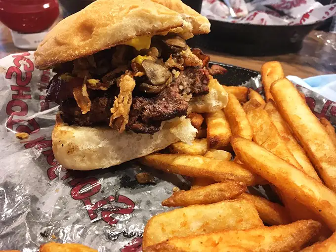 This isn't just a burger; it's a skyscraper of savory satisfaction. Warning: may cause spontaneous "mmm" noises.
