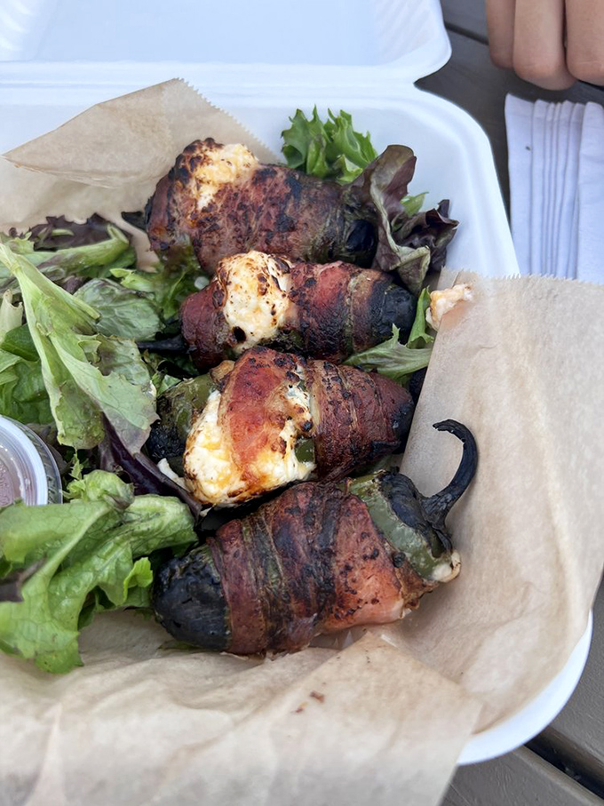 Bacon-wrapped jalapeño poppers: Where heat meets sweet in a crispy, cheesy package. It's like a flavor fiesta in your mouth!