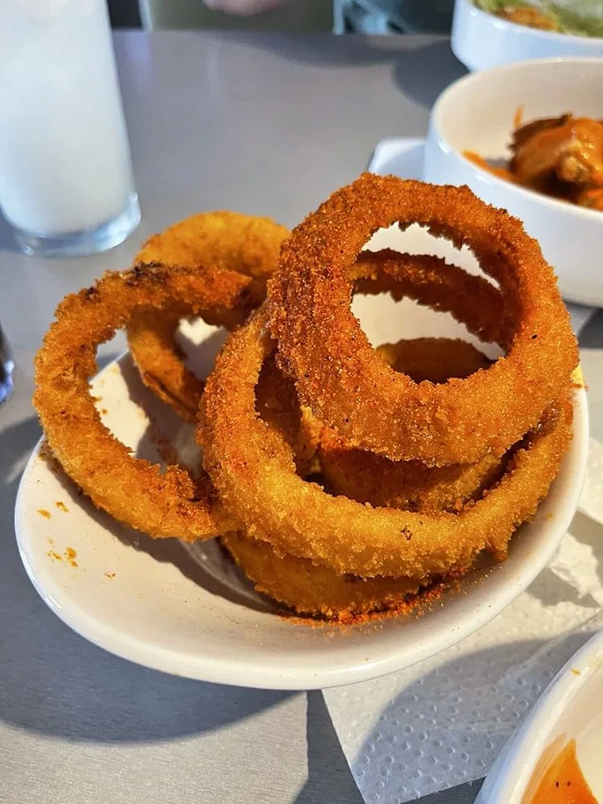 Onion rings with the perfect crunch-to-onion ratio – these golden halos are what fast food versions dream of becoming when they grow up.