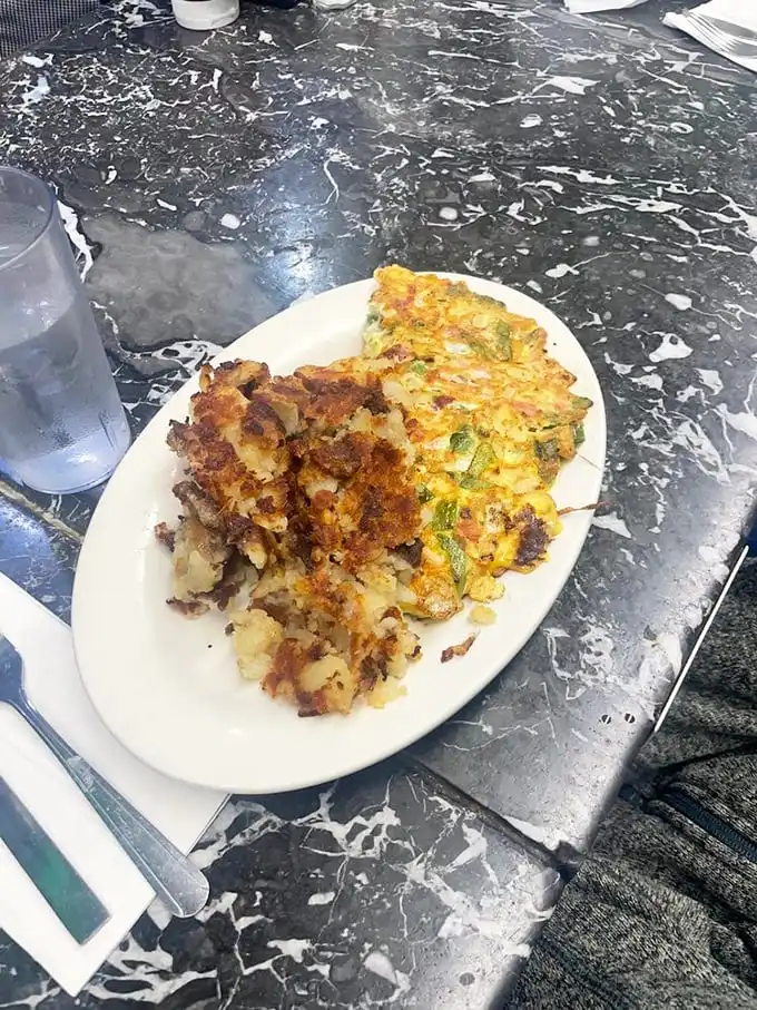 This isn't just breakfast – it's edible architecture. Layers of Taylor ham, eggs, and potatoes creating the skyscraper of satisfaction every New Jerseyan dreams about.