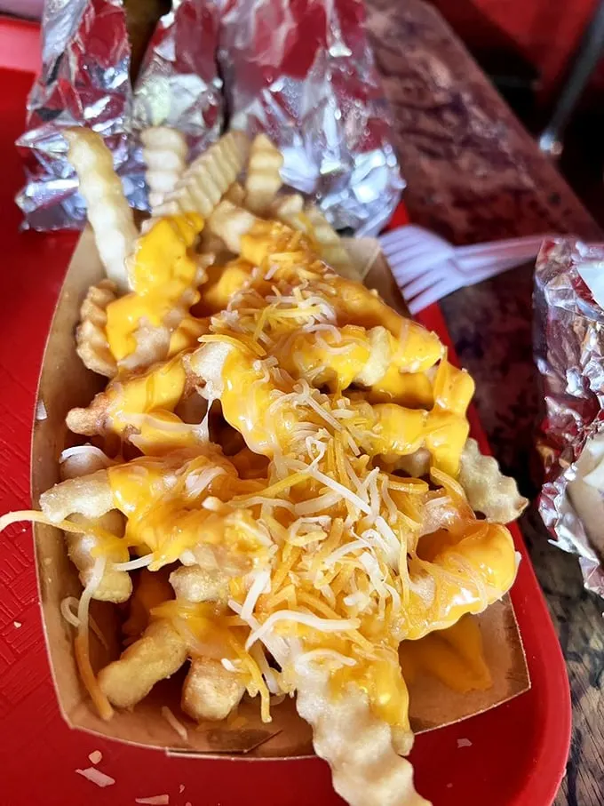 Cheesy does it! These fries are so smothered in gooey goodness, they could star in their own dairy-tale romance.