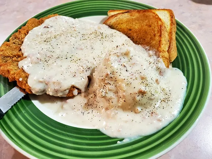 Chicken fried steak: Where Southern comfort meets Midwestern hospitality. It's like a warm, crispy blanket for your taste buds.