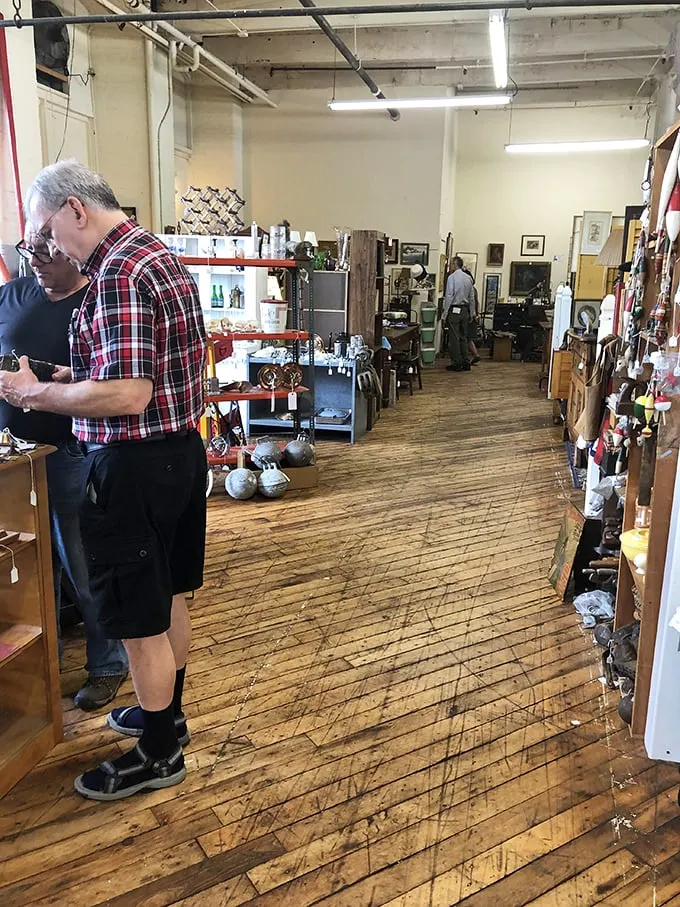 Plaid-clad time travelers examining relics of the past. Indiana Jones would be jealous of these antique adventurers.