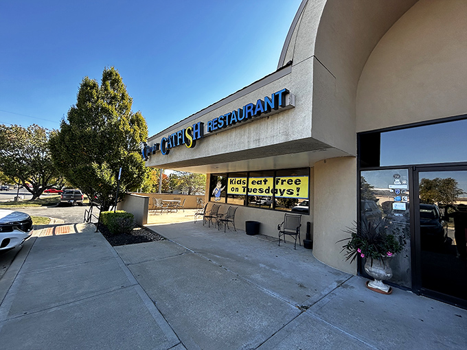 Jumpin' Catfish: Where enthusiasm is always on the menu. That sign's not just announcing; it's doing a full cheerleading routine!