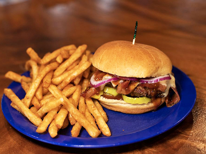 This isn't just a burger—it's architecture. The perfect stack of beef, pickle, onion and bun, with fries that look like they're auditioning for a food commercial.