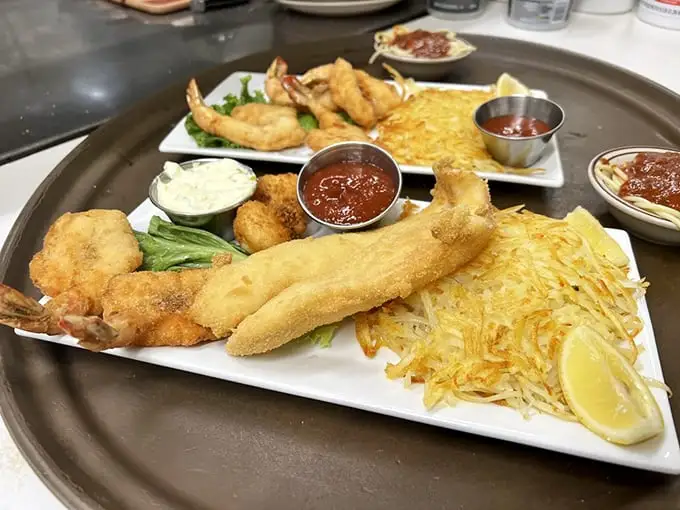 Seafood that would make coastal restaurants jealous, served with hash browns so crispy they deserve their own fan club.