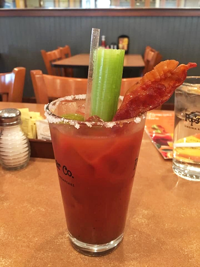 This isn't just a Bloody Mary—it's breakfast in a glass, complete with a bacon strip that doubles as both garnish and appetizer.
