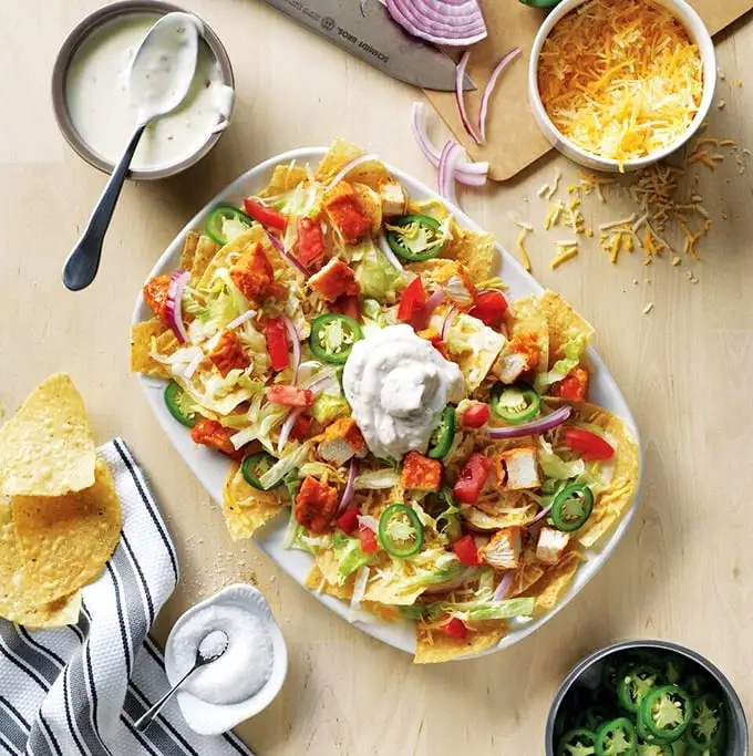 Buffalo chicken nachos that solve the age-old dilemma: "Do I want wings or nachos tonight?" The answer is gloriously both.