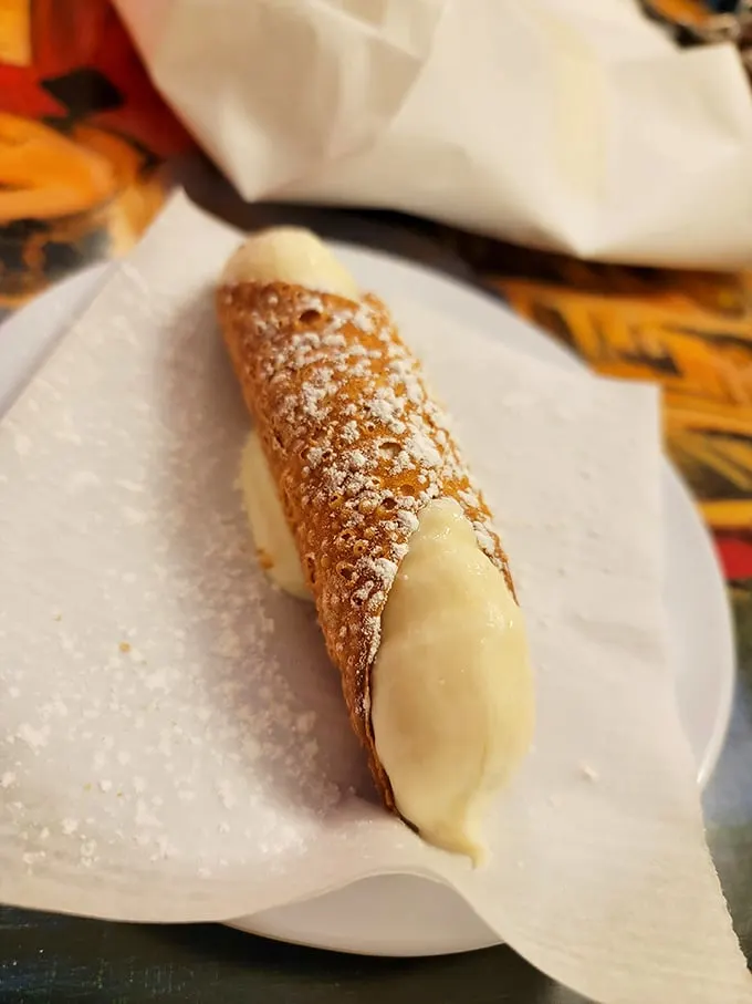 Meet the cannoli of your dreams! This crispy, creamy treat is the perfect finale to your pizza adventure – if you can save room, that is.