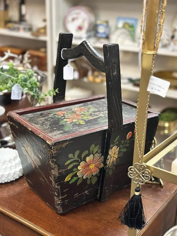 A hand-painted wooden rice basket that's traveled further than most people's vacation photos—and looks better too.