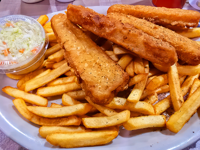 The catch of the day just caught your attention! Golden-fried fish and crispy fries – it's like a beach vacation for your mouth, minus the sand.