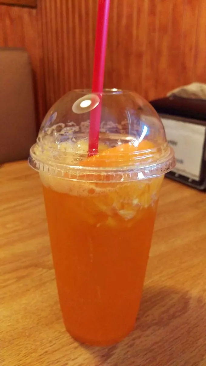 Sunshine in a cup! This orange spritzer is like a mini vacation for your mouth – no sunscreen required.