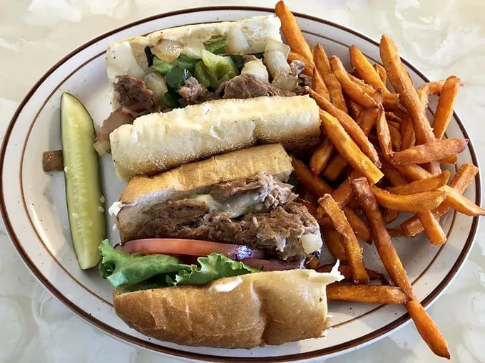 Philly, meet Virginia! This cheesesteak is a cross-country flavor explosion. Tender meat, gooey cheese, and a side of crispy fries – it's a match made in diner heaven.