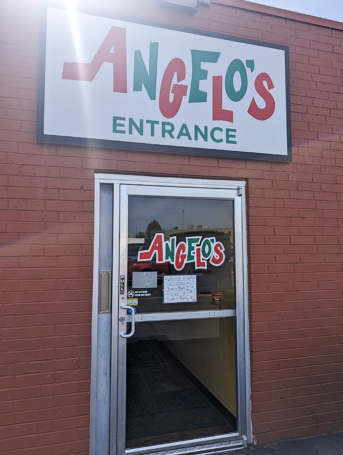 The no-nonsense entrance to Angelo's—where they've been keeping it real since Eisenhower was president.