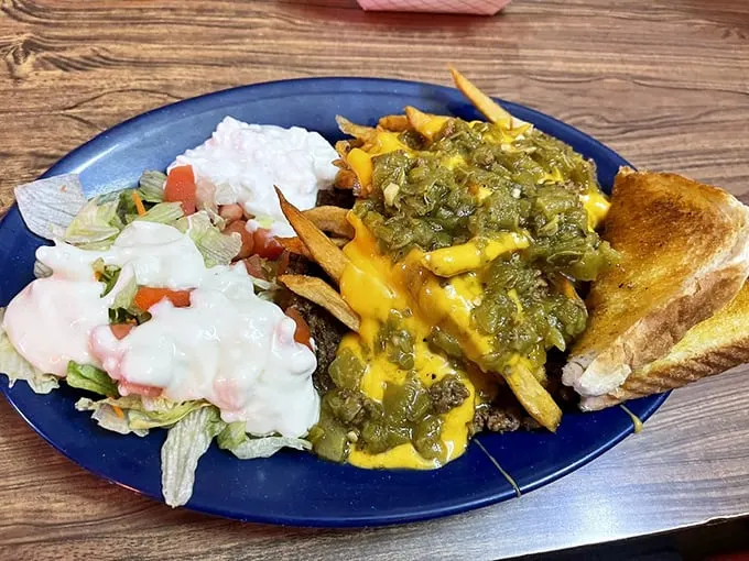 This isn't just a meal, it's a flavor fiesta! Green chile, cheese, and fries – oh my! Dorothy, we're definitely not in Kansas anymore.
